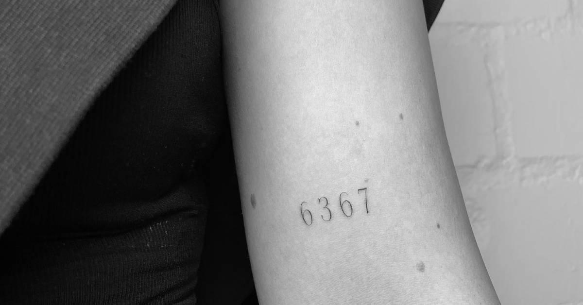 Tattoo of the number "6367" done on the bicep.