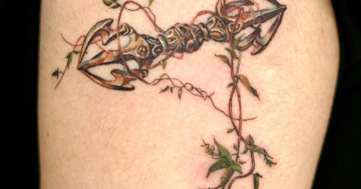 Vajra tattoo located on the upper arm, done in
