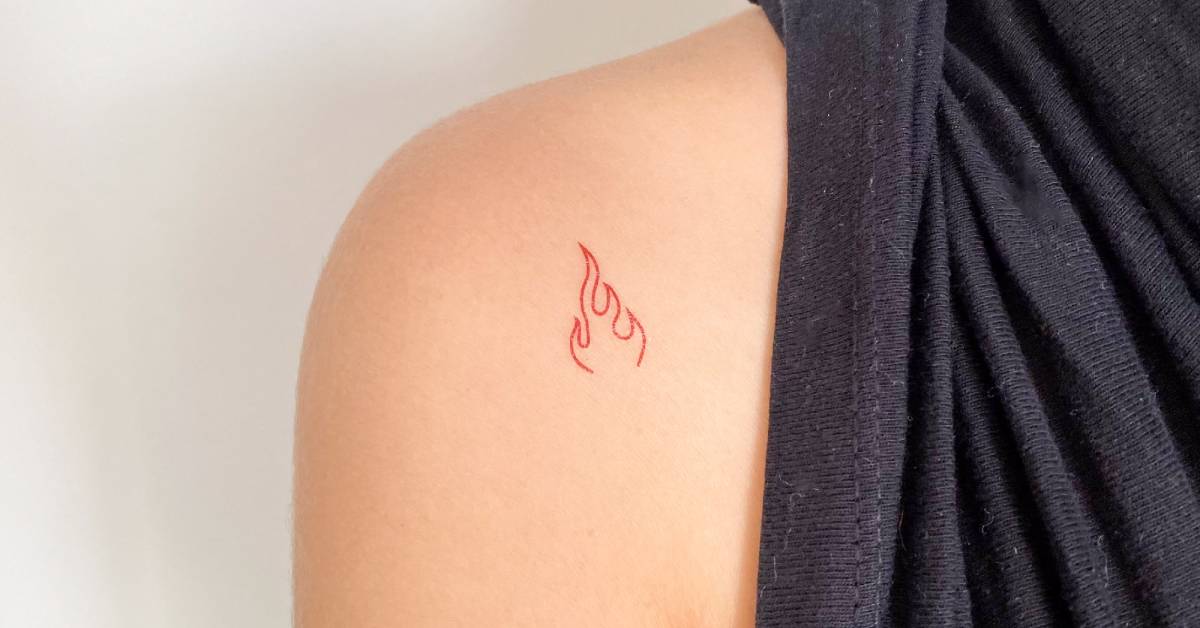 Red fire flame temporary tattoo located on the