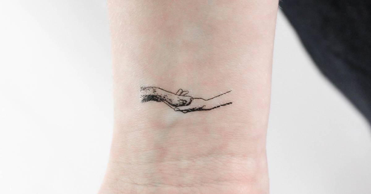 Dog and Human handshake temporary tattoo located on the
