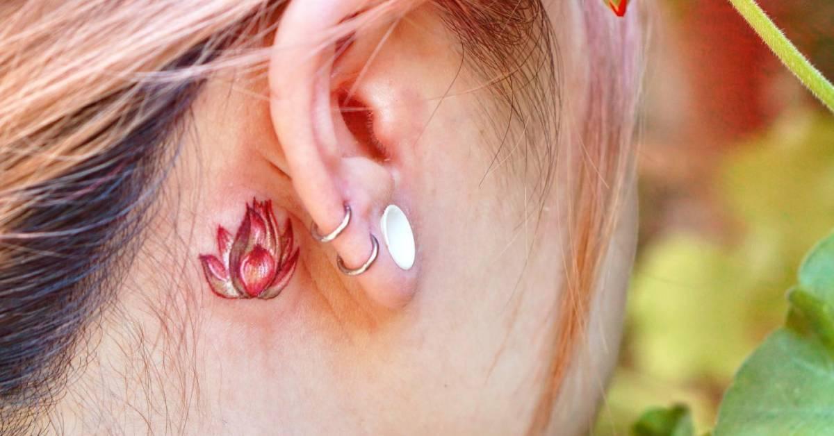 Lotus flower tattoo behind ear - Bronctattooaus.com