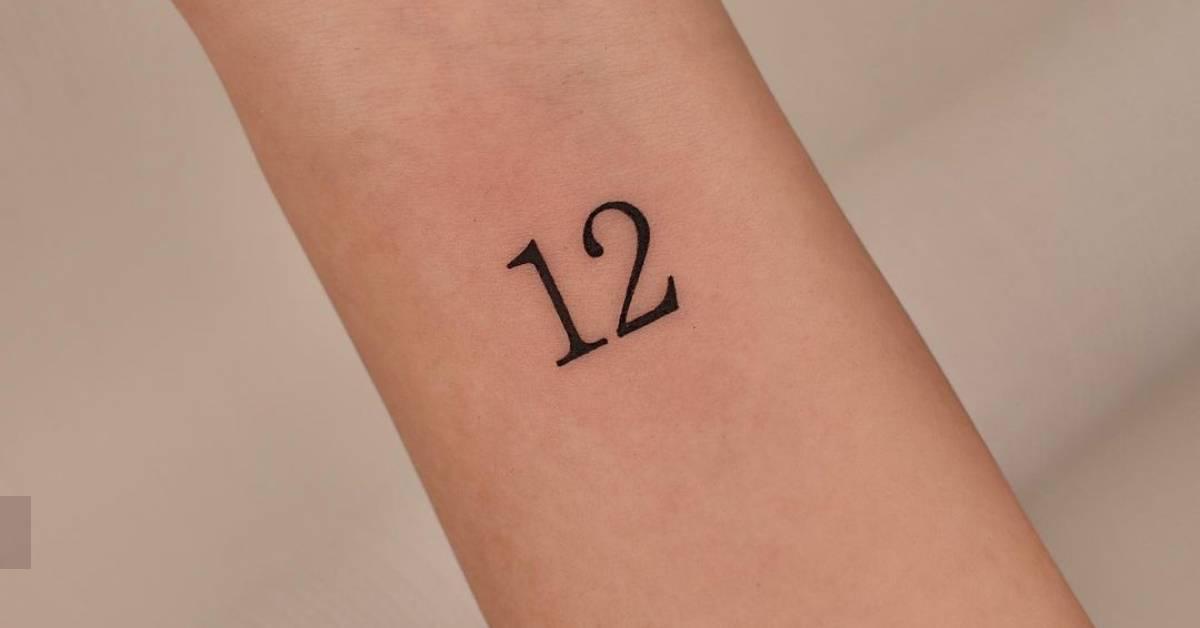 Number "12" tattooed on the wrist