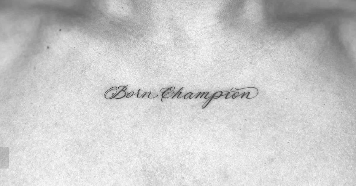 "Born champion" lettering tattoo located on the