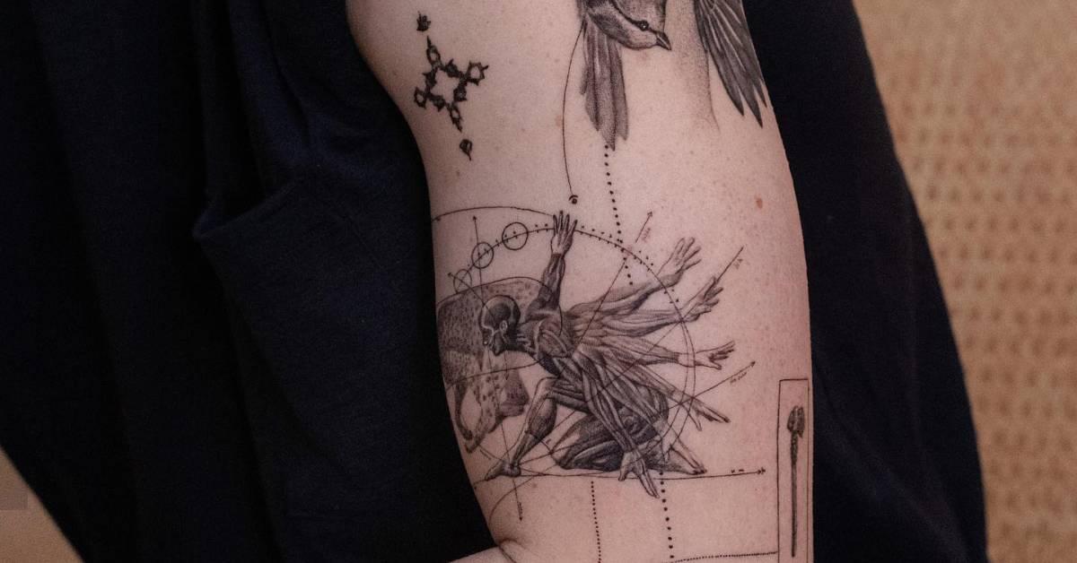 Evolution themed arm composition tattoo.