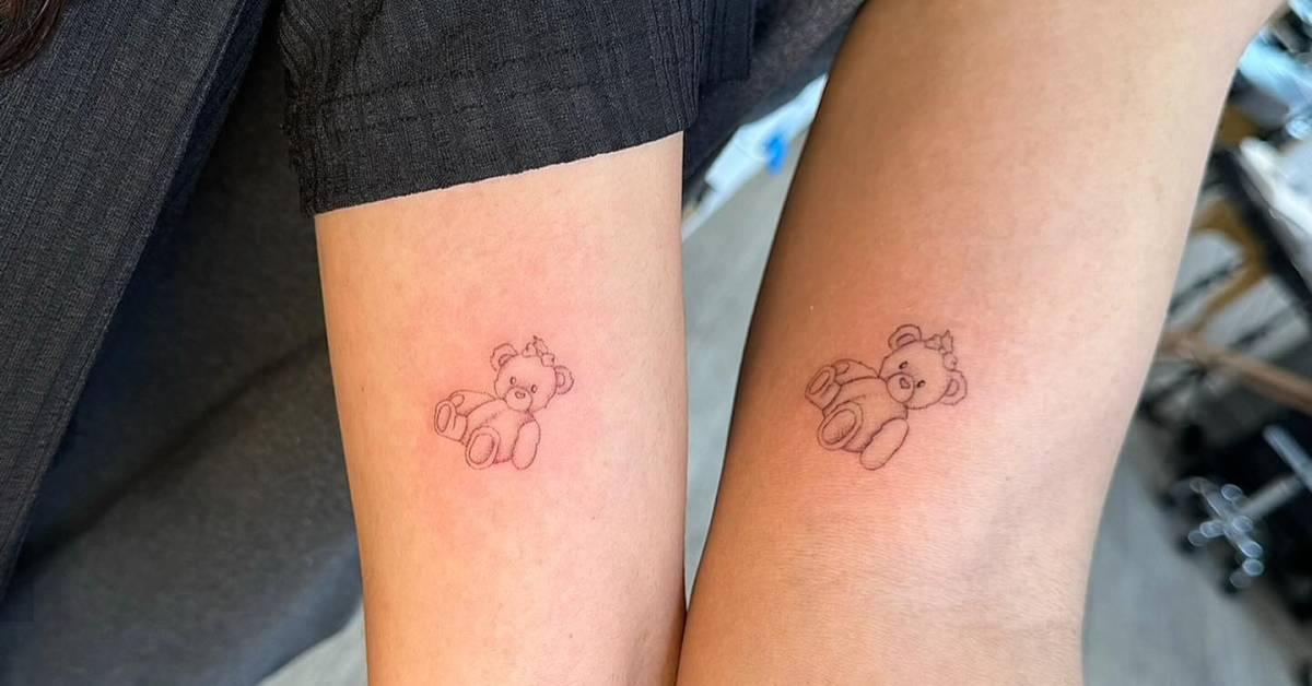 Matching fine line teddy bear tattoo for couple.