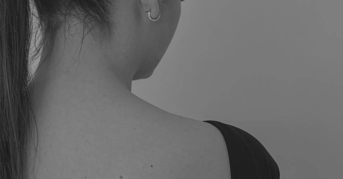 "Year of rebirth" lettering tattoo placed on the