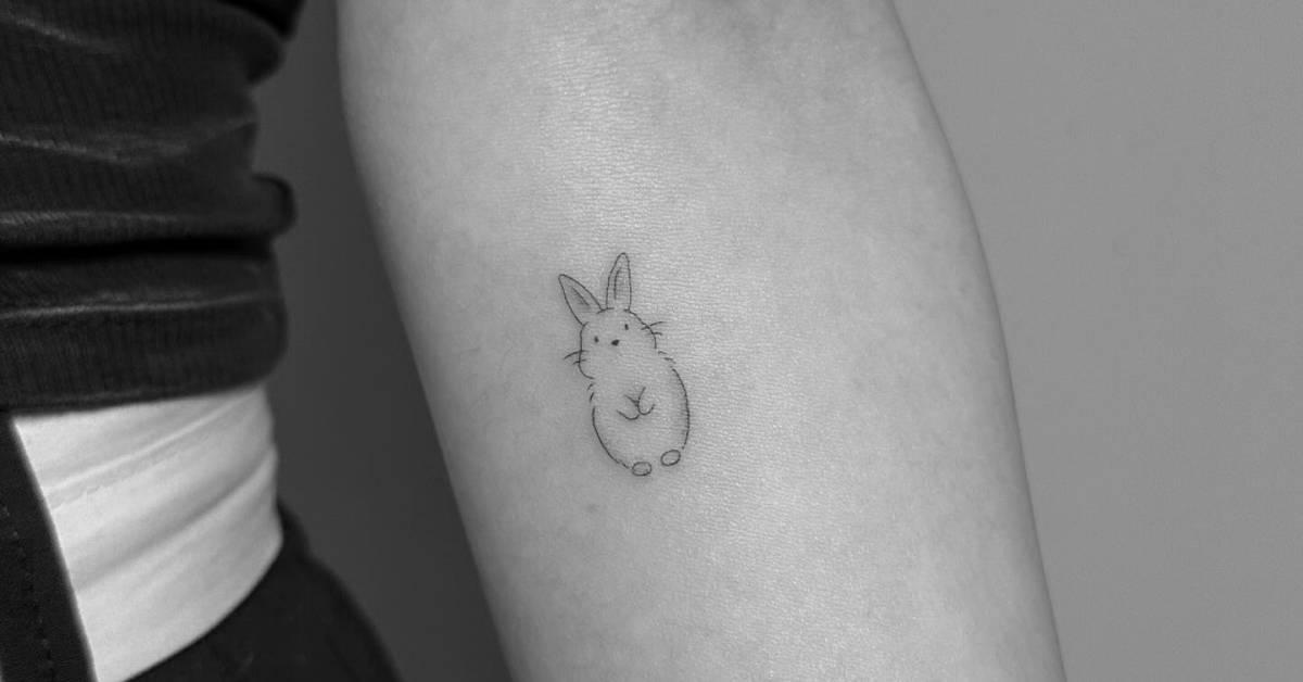 Minimalistic style bunny tattoo done on the inner