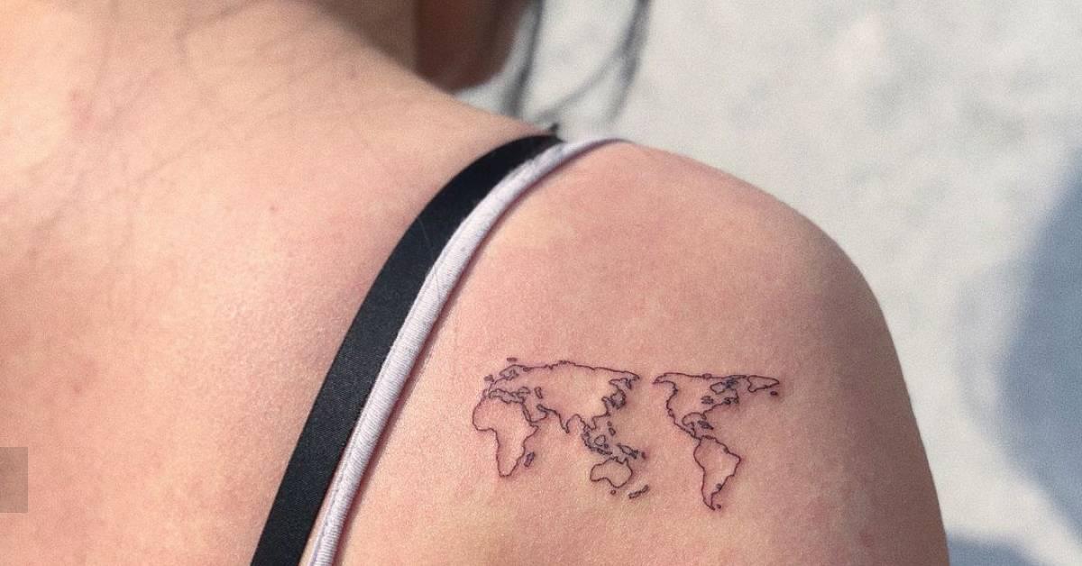 Fine line style world map tattoo located on the