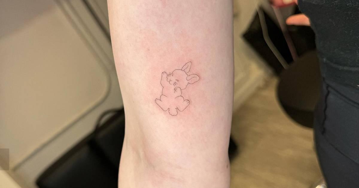 Single needle bunny tattoo located on the inner arm.