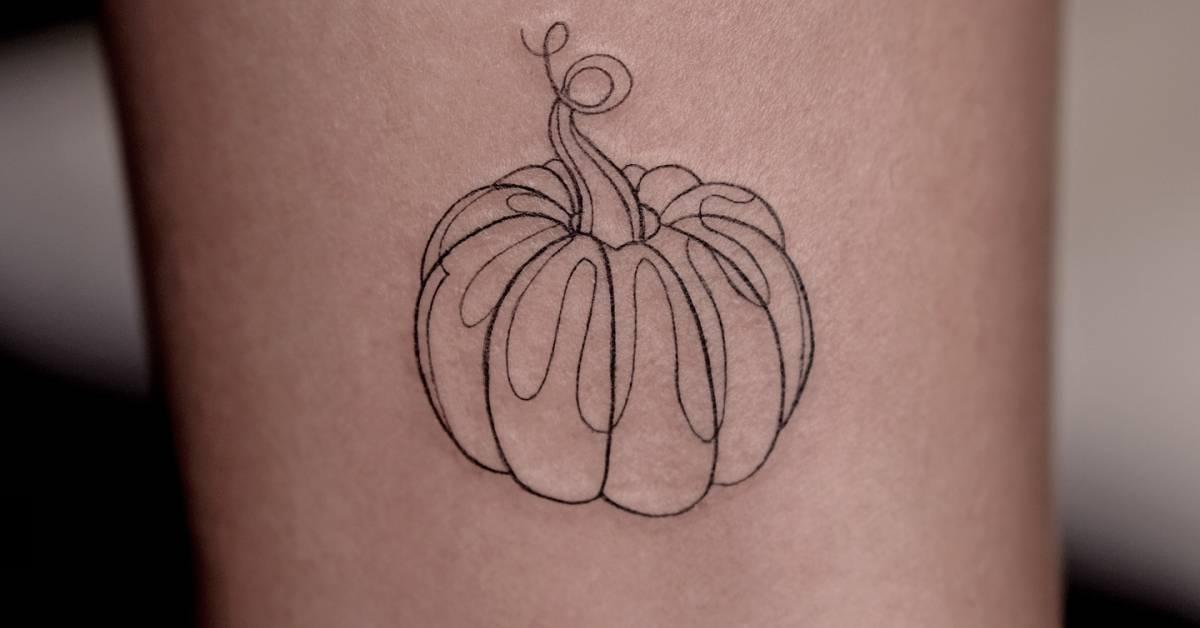 Fine line style pumpkin tattoo located on the wrist.