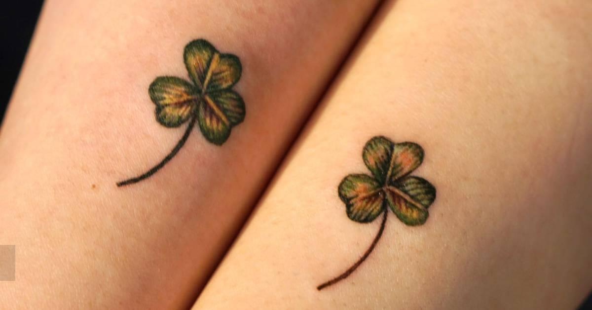 Matching three leaf clover tattoo for couple.