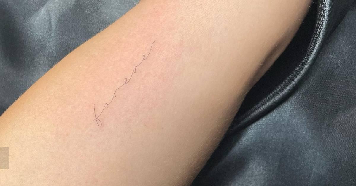 "Forever" lettering tattoo handwritten on the inner