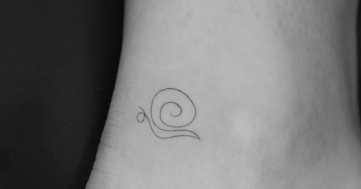 Continuous line snail tattoo located on the ankle.