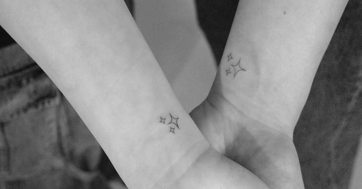 Minimalistic matching stars tattoo for couple.