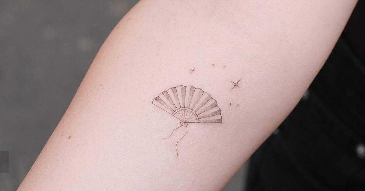 Single needle hand fan tattoo located on the inner