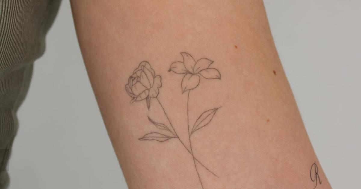 Healed fine line style peony and lily flower tattoo