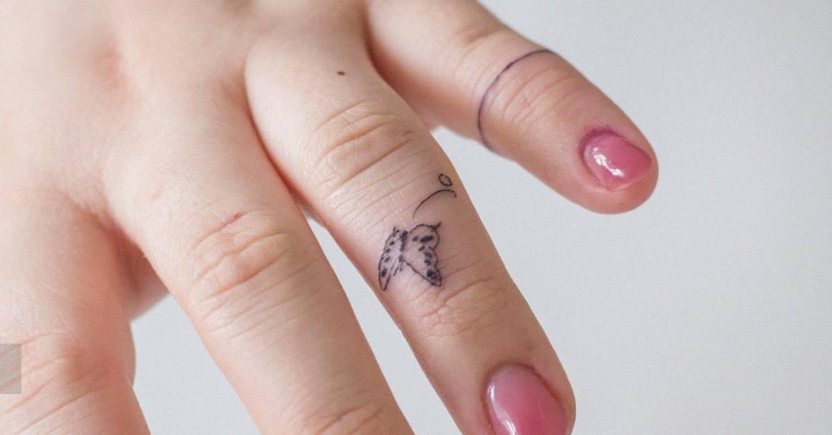 Minimalistic style butterfly and ring tattoos located