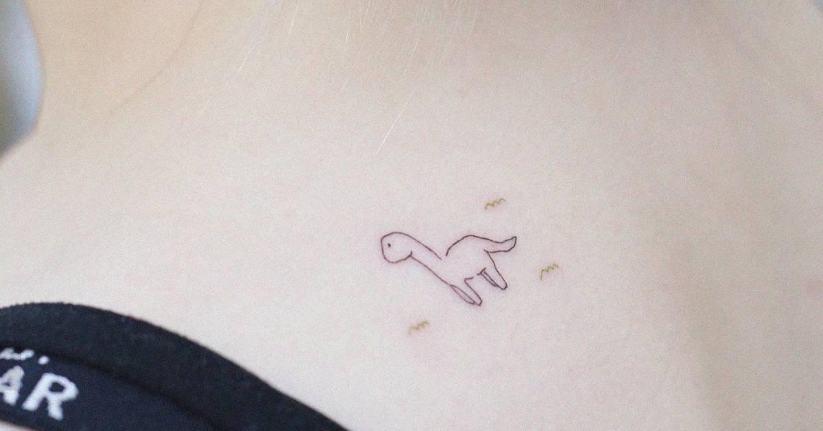 Minimalistic style diplodocus tattoo located on the