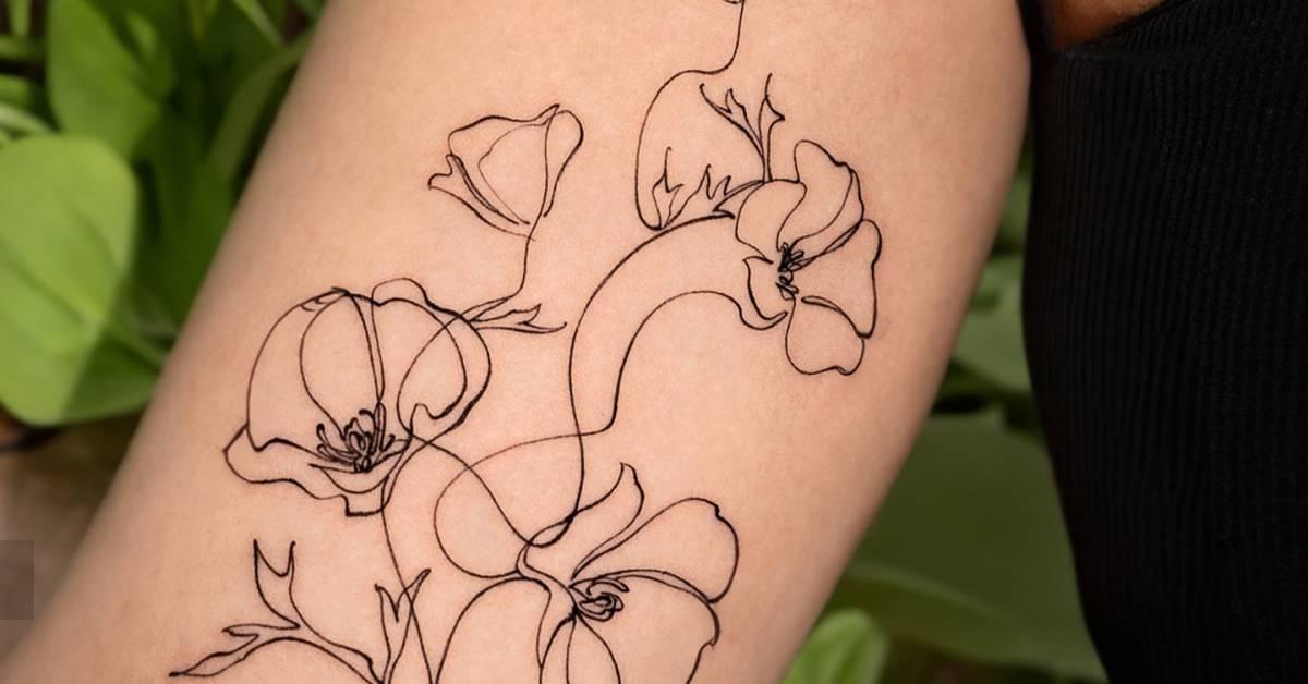 Continuous line California poppy tattoo located on the