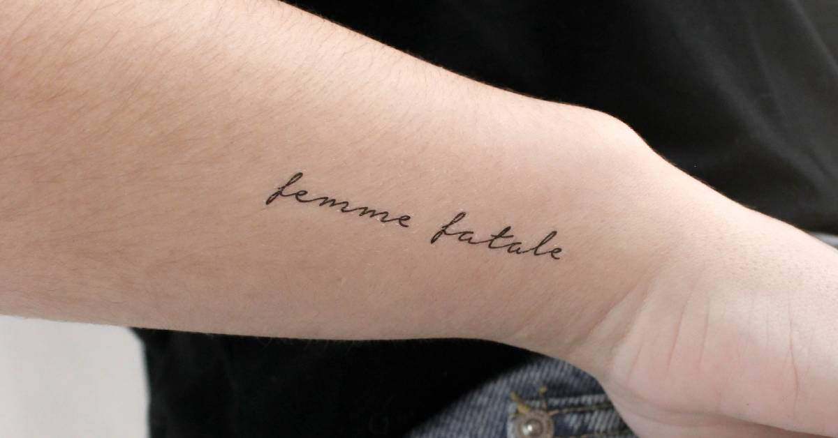 Femme fatale temporary lettering tattoo done on the