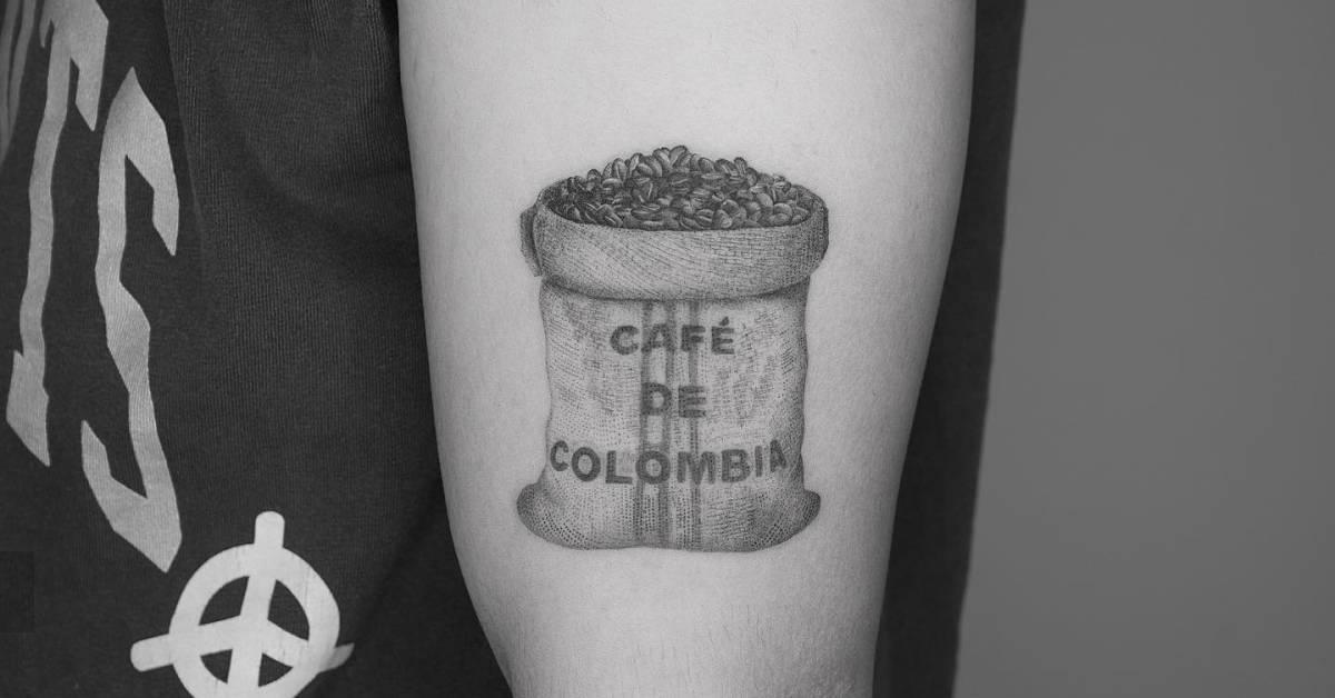 Colombian coffee beans tattoo located on the upper arm.