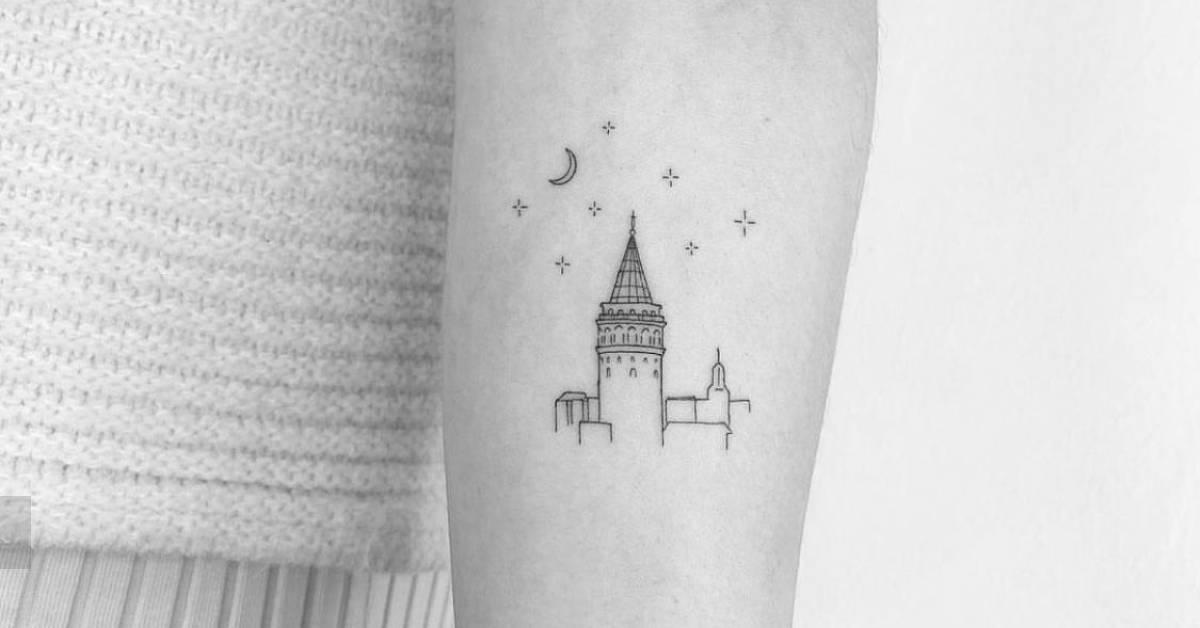 Fine line style Galata Tower tattoo located on the