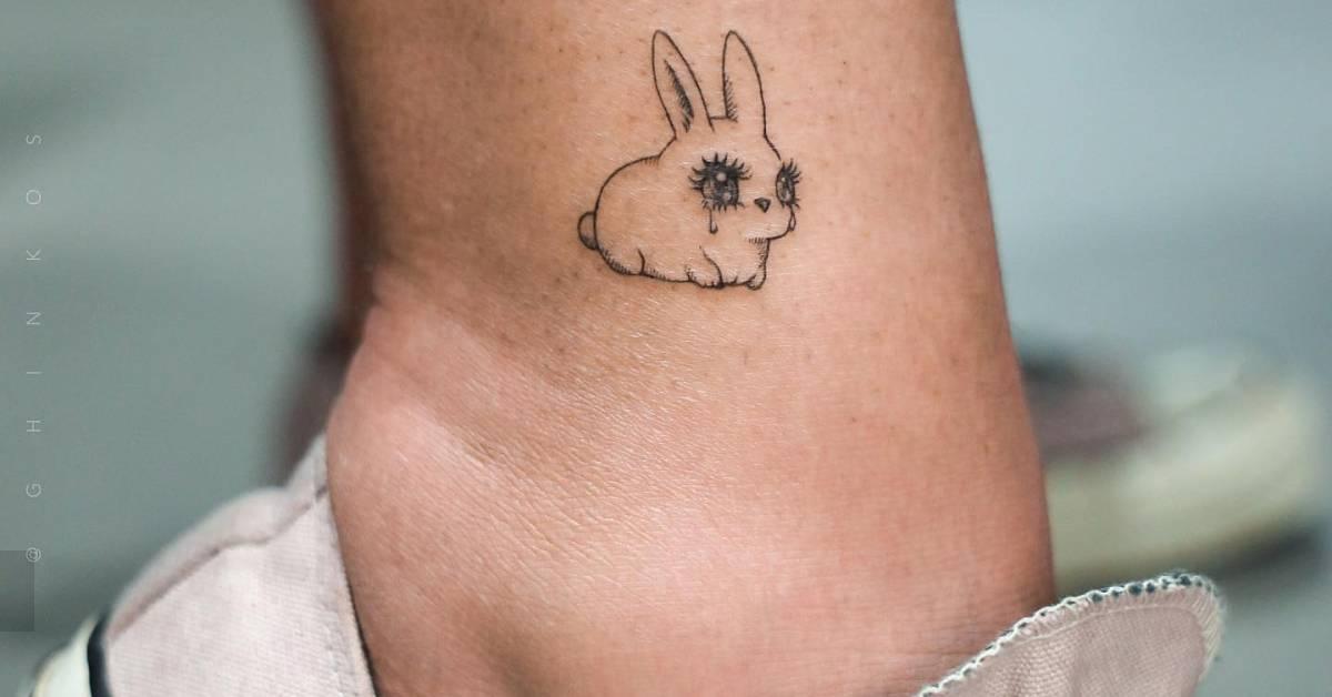 Cute little bunny tattoo placed on the ankle, cartoon