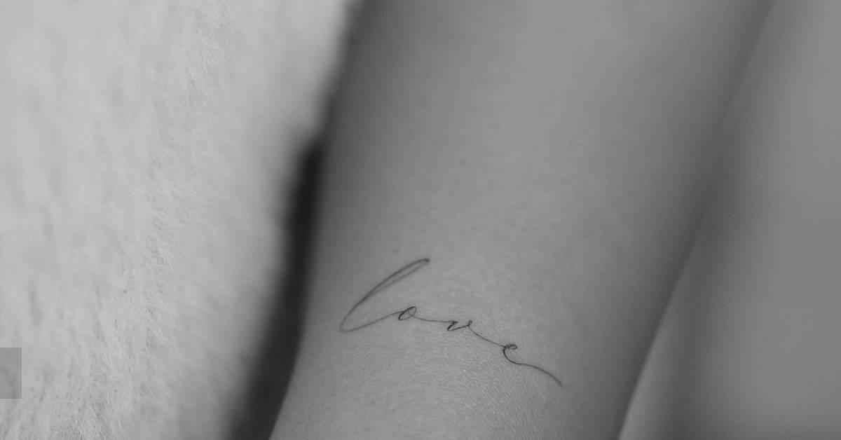 Tattoo of the word "love" located on the wrist.