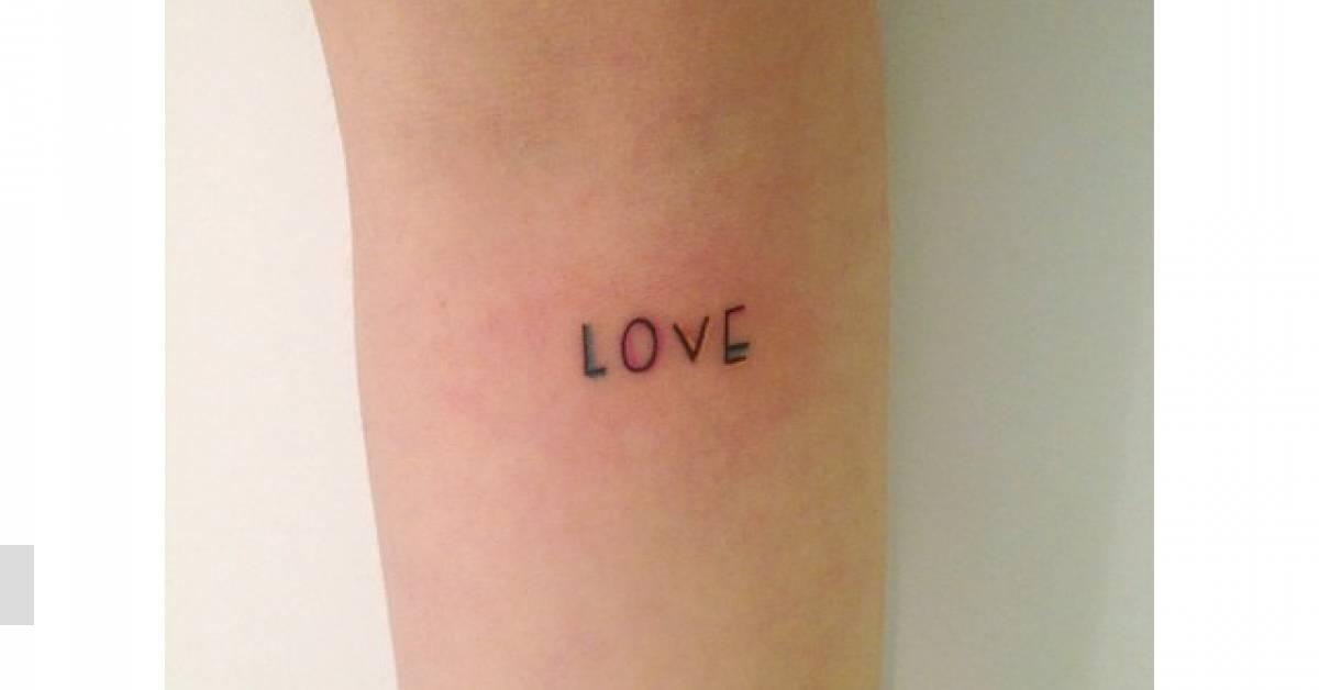 Tattoo of the word "love" located on the inner forearm.