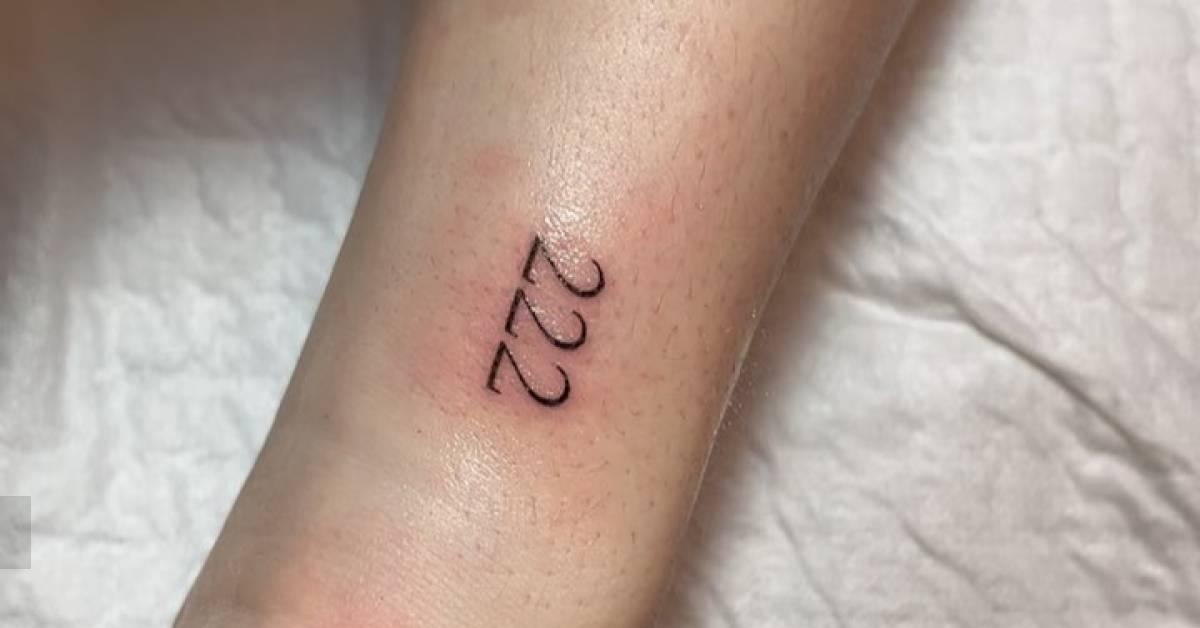 Tattoo of the number "222" located on the wrist.
