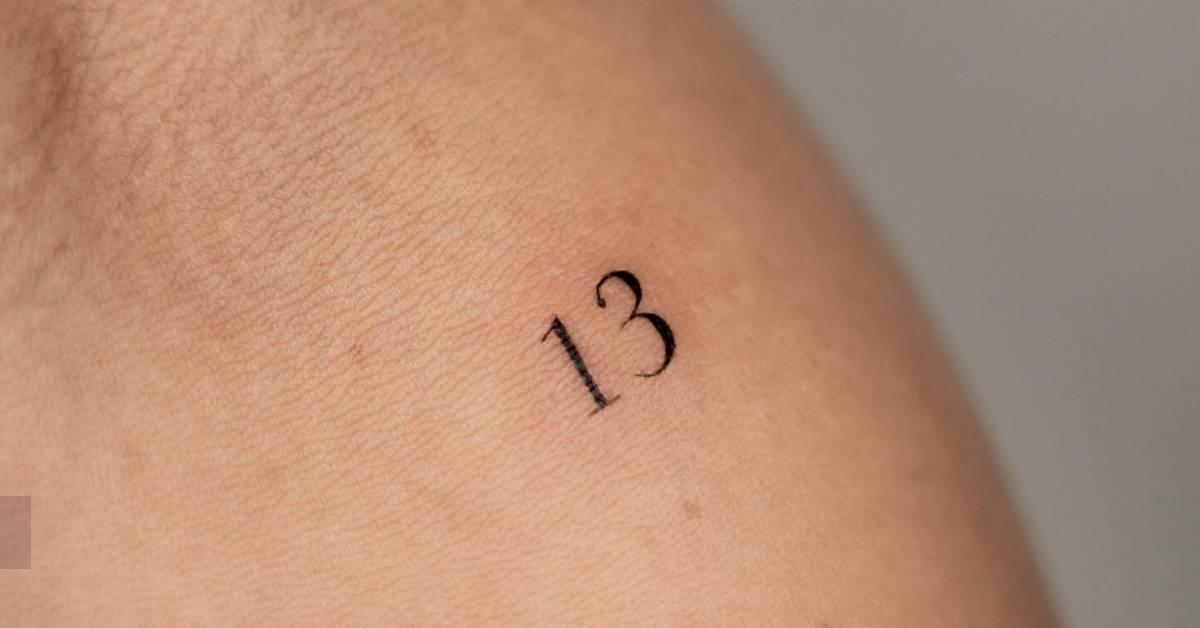 Lucky "13" tattoo located on the inner forearm.