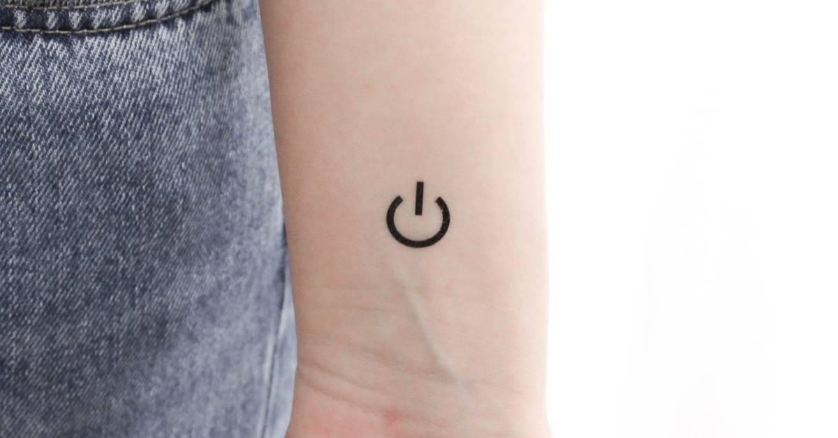 Power symbol temporary tattoo done on the wrist.
