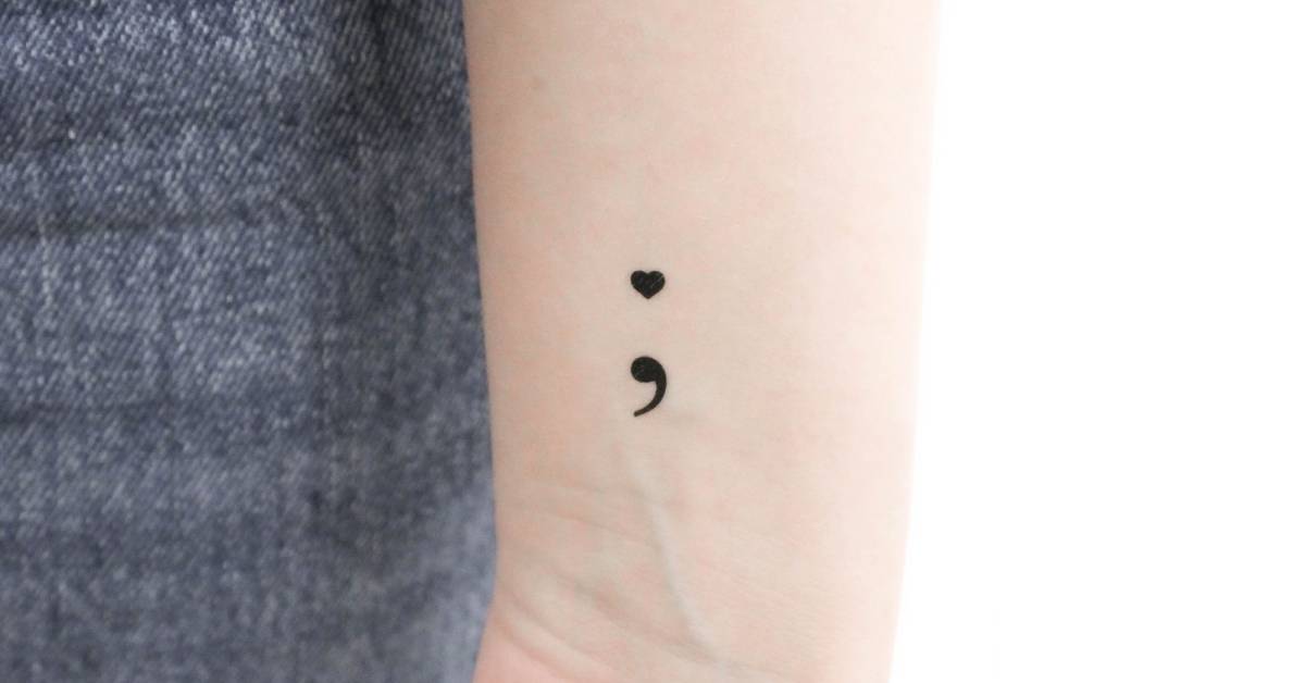Heart semicolon temporary tattoo placed on the wrist.