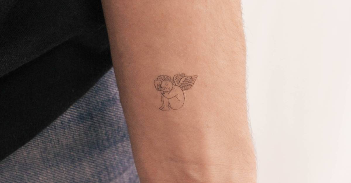 Fine line style cherub temporary tattoo done on the