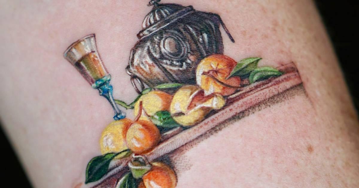 Watercolor style still life tattoo located on the inner