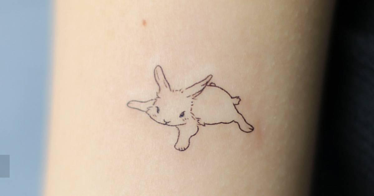 Fine line style rabbit tattoo located on the inner arm.