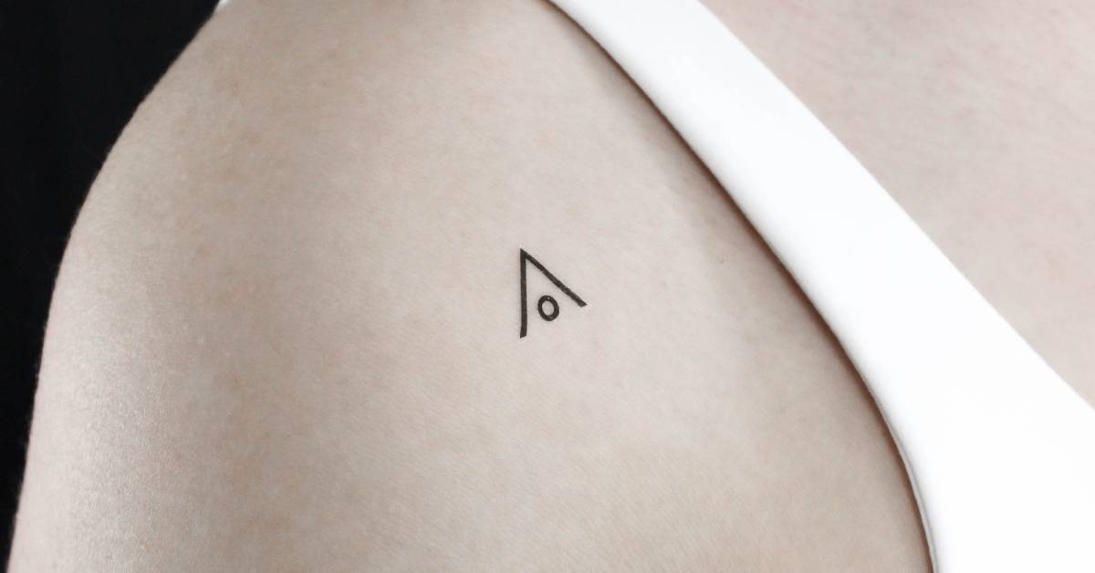Minimalistic style protect symbol tattoo located on the