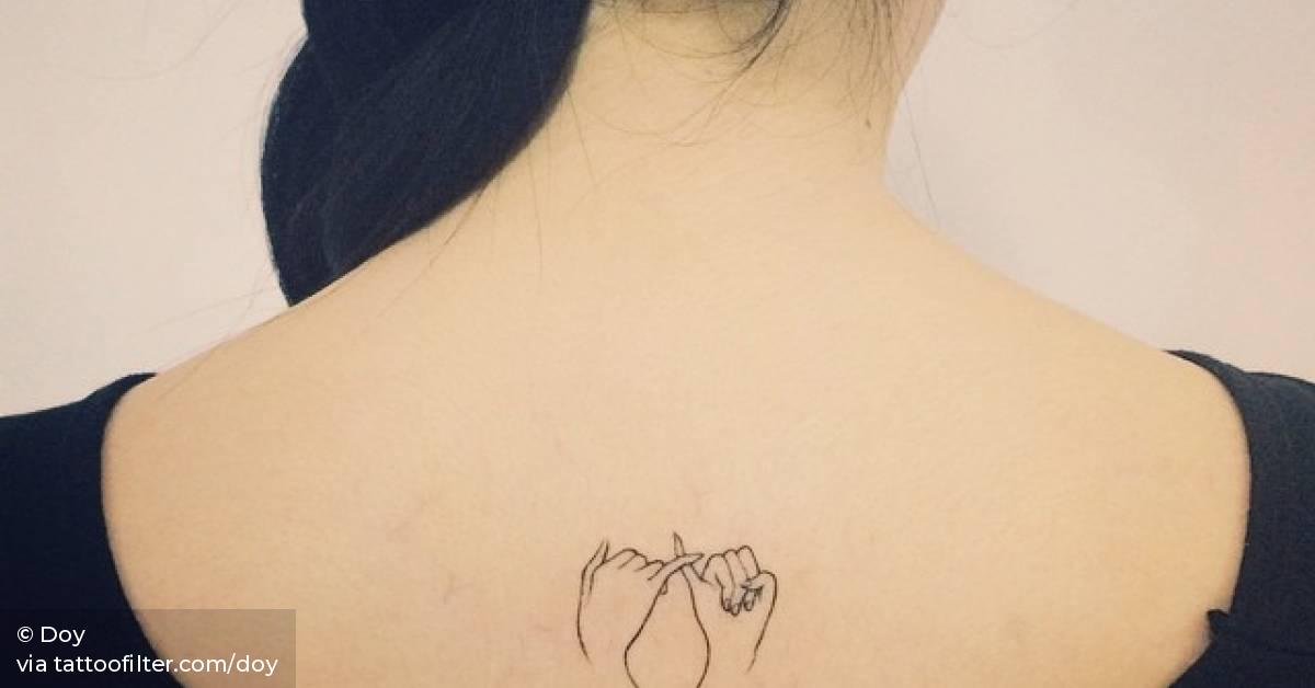 Fine line style hands on the upper back.