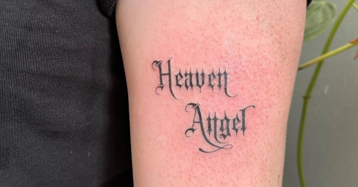 "Heaven angel" lettering tattoo located on the upper