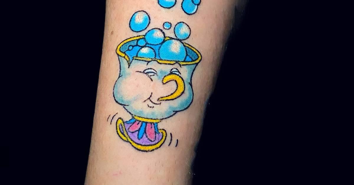 Cartoon style Chip tattoo located on the forearm.