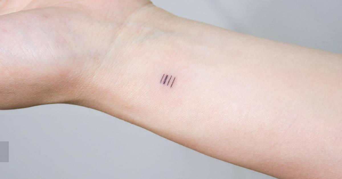 Minimalistic style barcode tattoo done on the wrist.