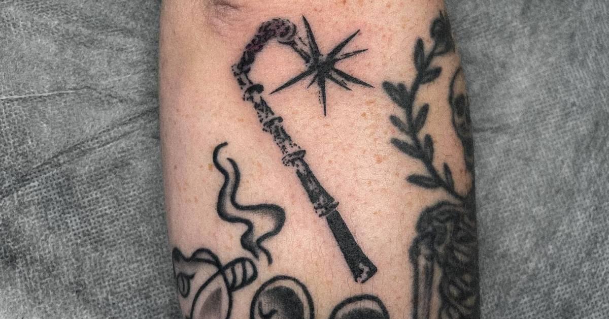 Flail tattoo located on the forearm, illustrative