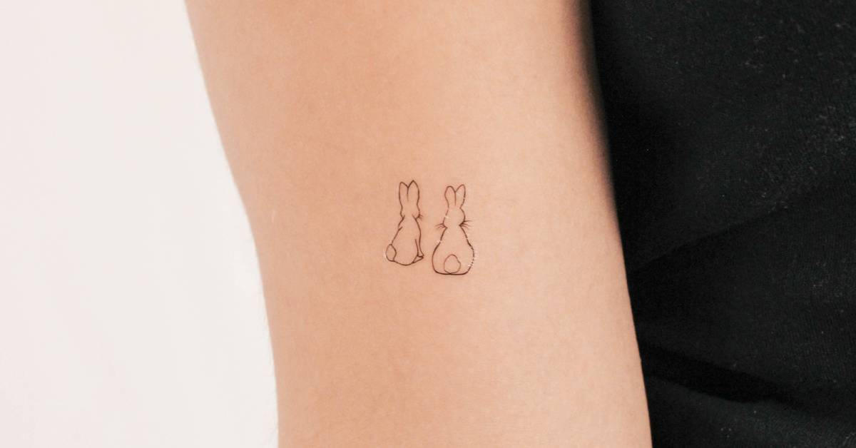 Fine line style rabbit couple temporary tattoo located