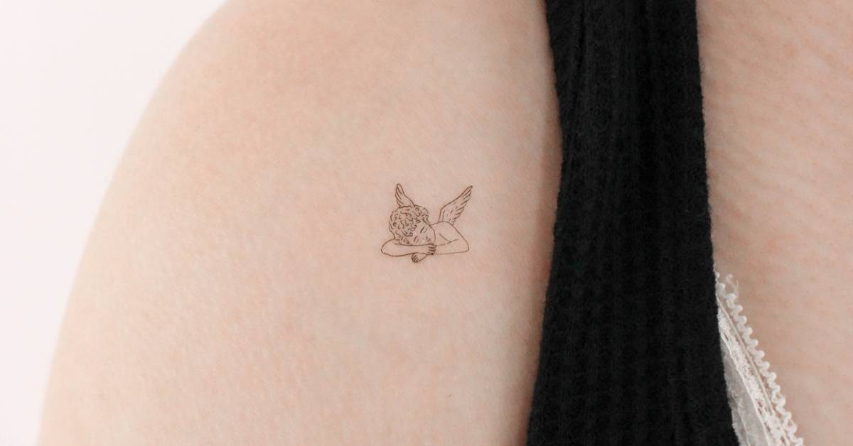 Fine line style sleeping cherub temporary tattoo