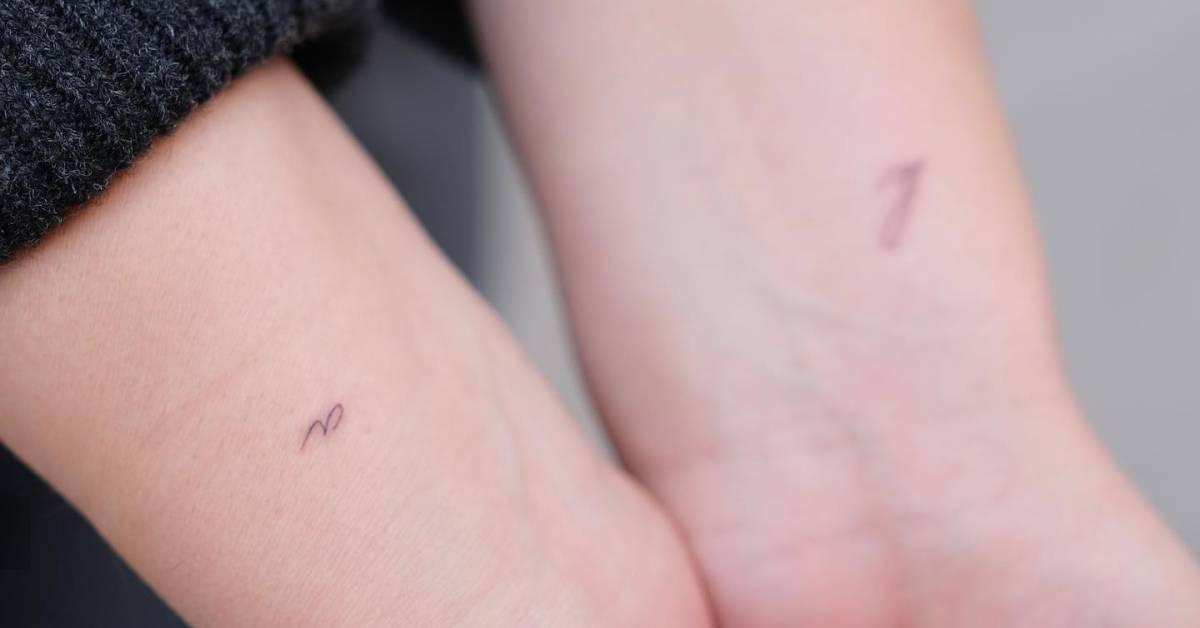 Minimalistic style letter "a" tattoo done on the wrist.