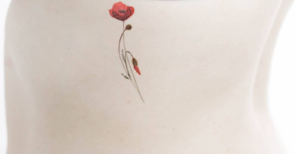Watercolor style poppy temporary tattoo located on the