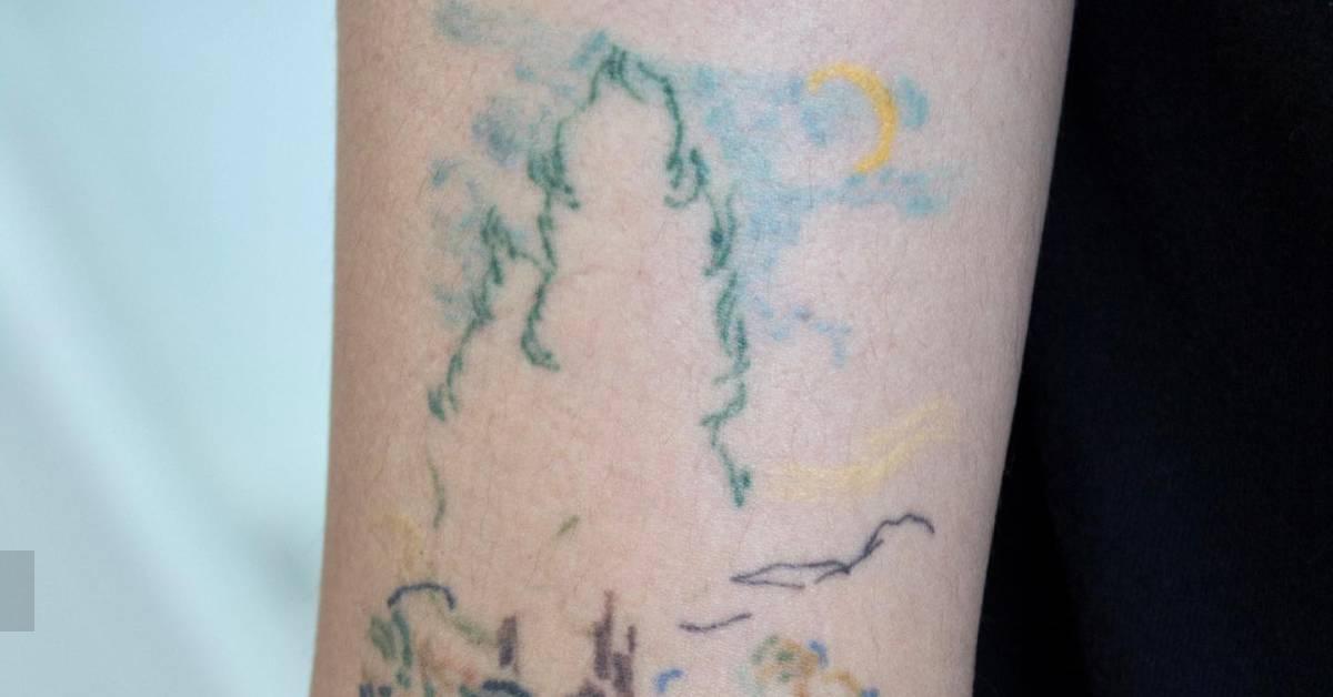 Healed abstract landscape tattoo in watercolor style.
