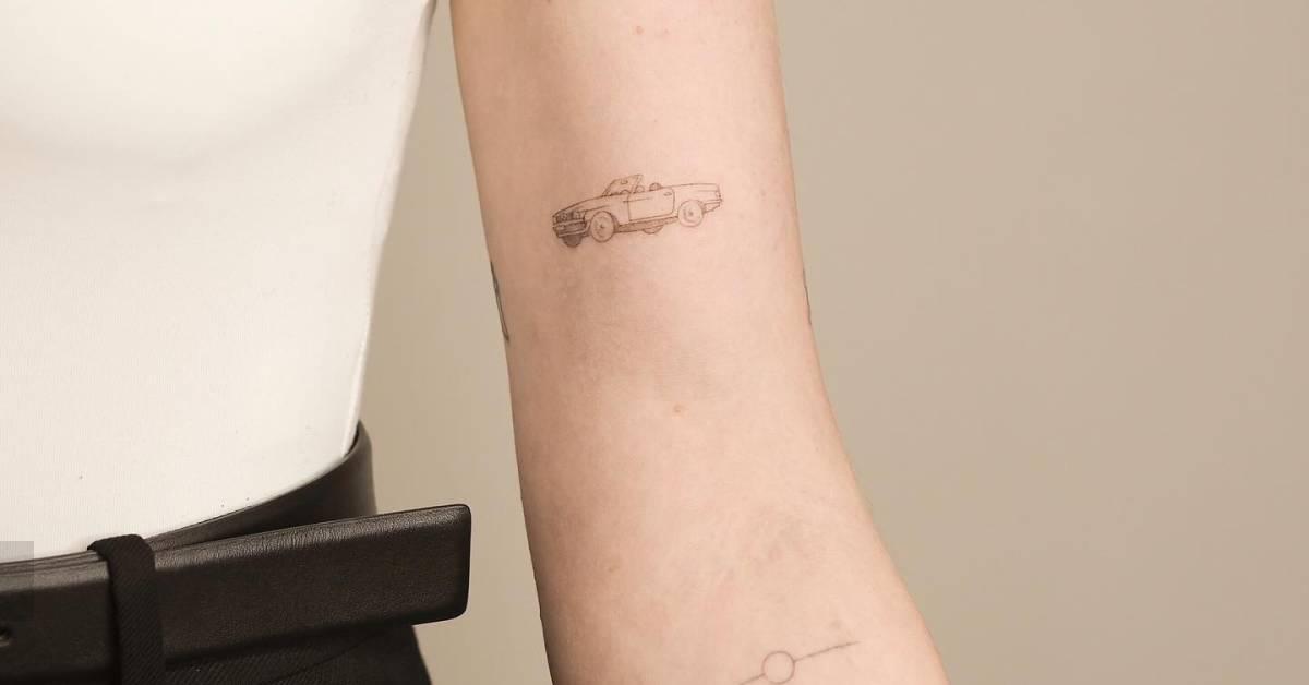 Fine line arm composition tattoos.