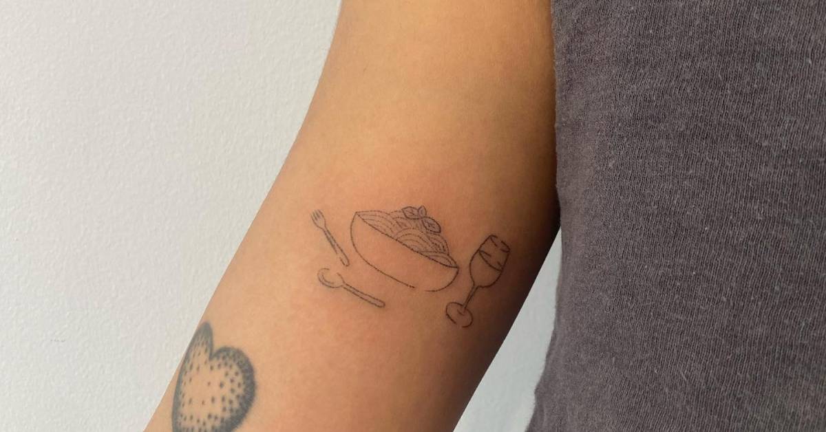 Hand poked fine line spaghetti tattoo located on the