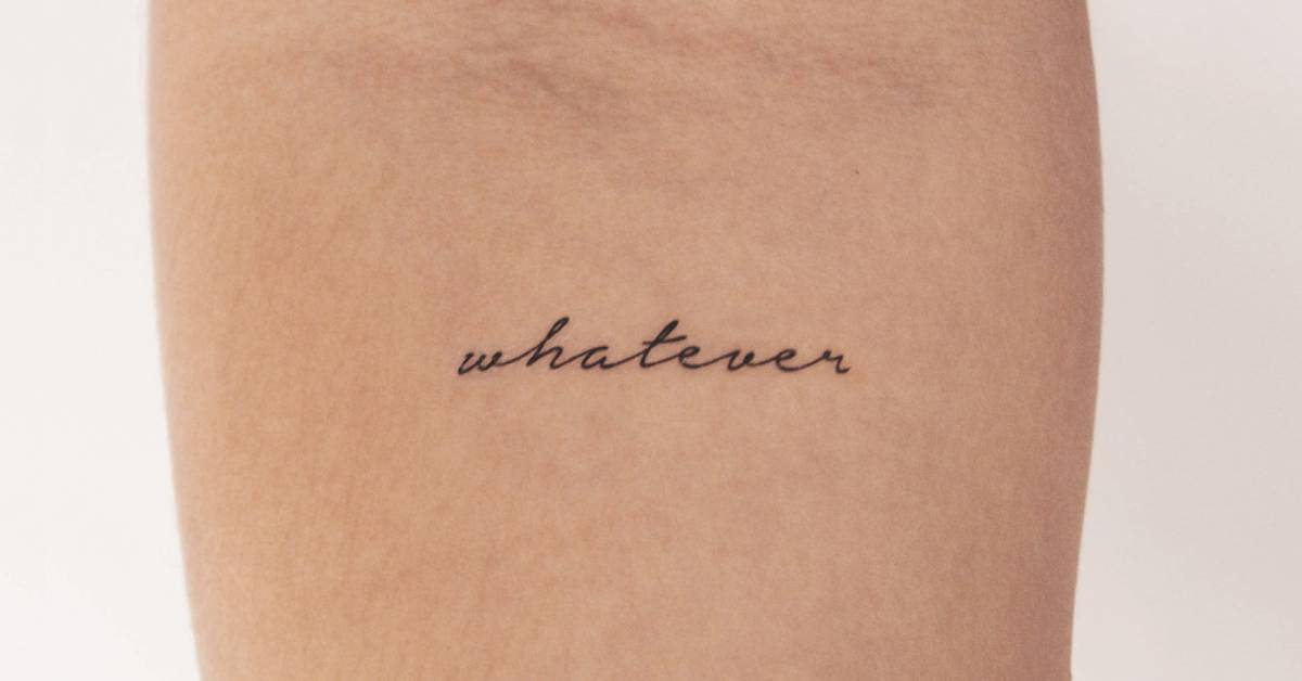 "Whatever" temporary lettering tattoo placed on the